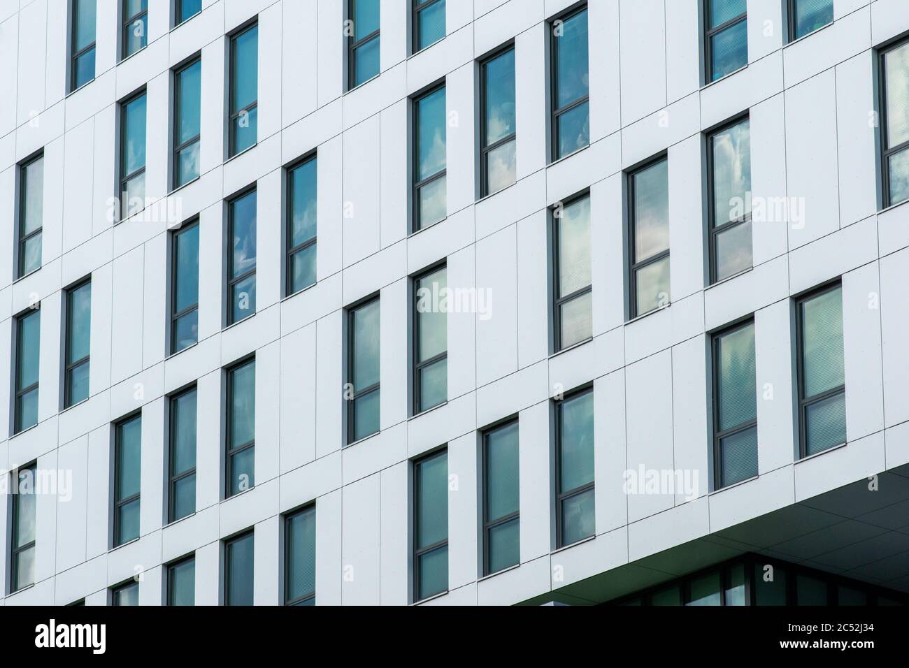 White corporate building with blue windows Stock Photo - Alamy