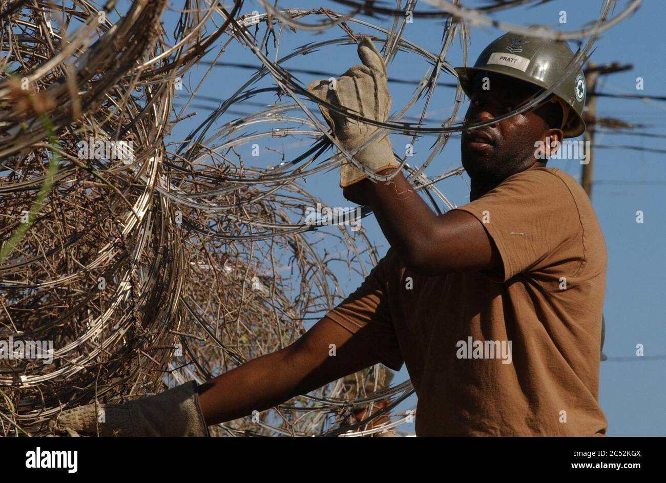 Installing razor wire at Camp XRay, Guantanamo Stock Photo - Alamy