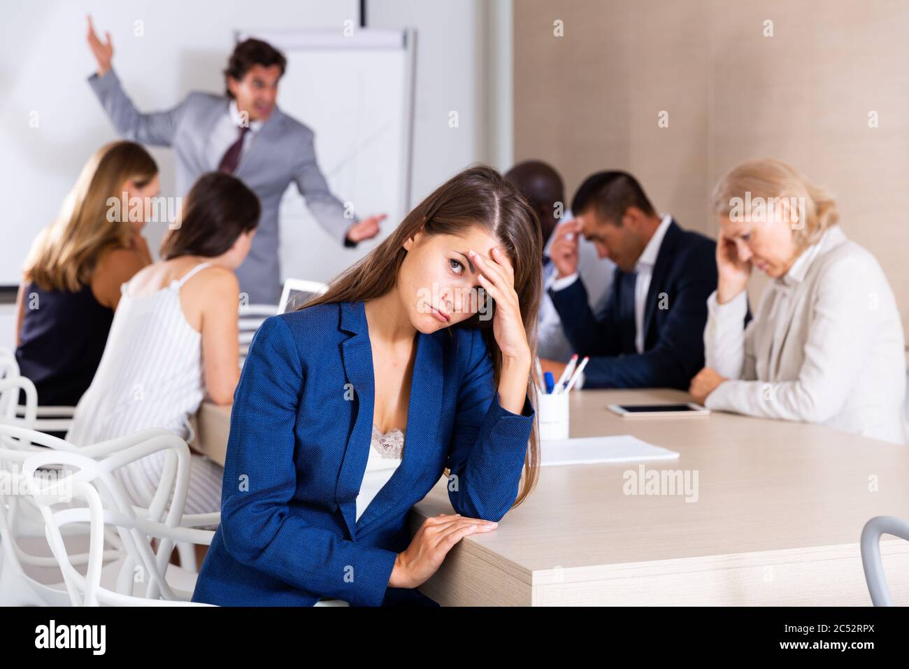 Upset business woman on meeting with colleagues and angry boss Stock ...