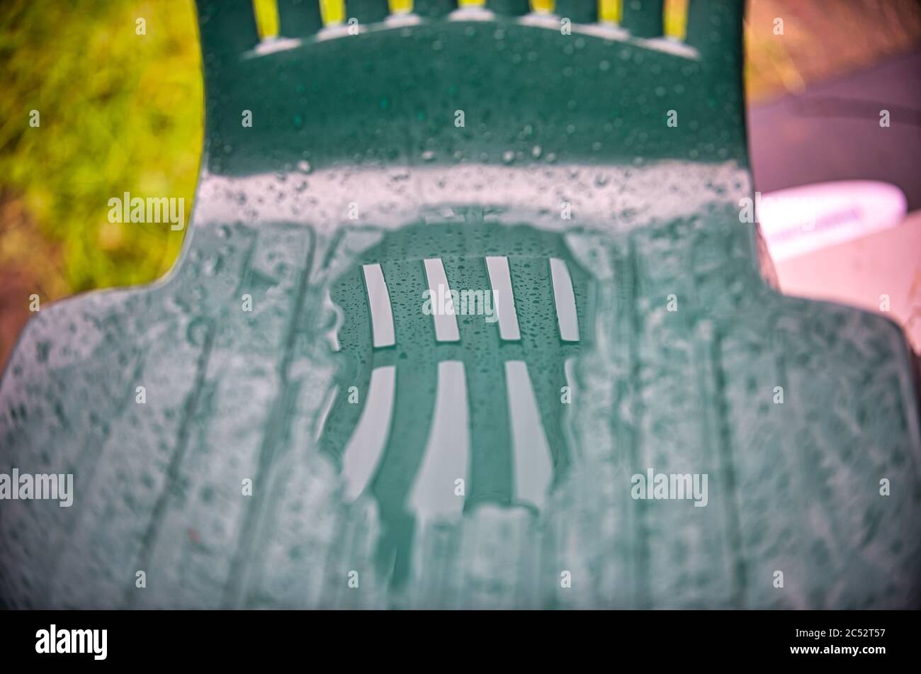 Water puddle on a camping chair after the rain Stock Photo - Alamy