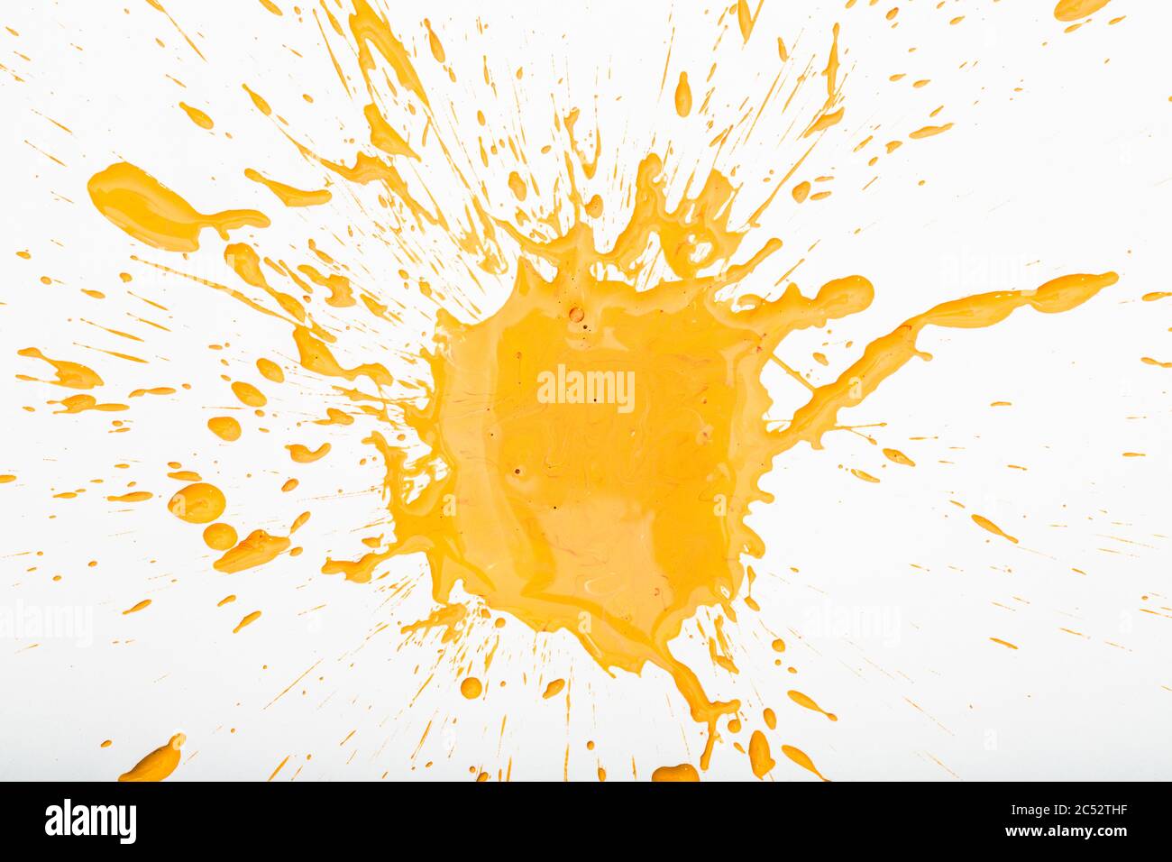 Blot and splashes of yellow paint isolated on white background Stock ...