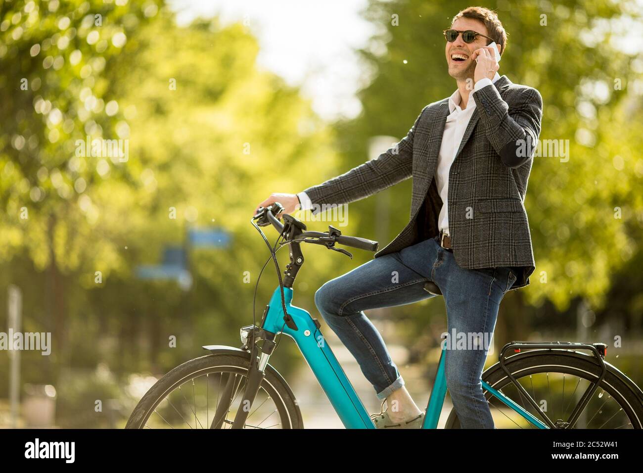 Young handsome businessman bike hi-res stock photography and images - Alamy