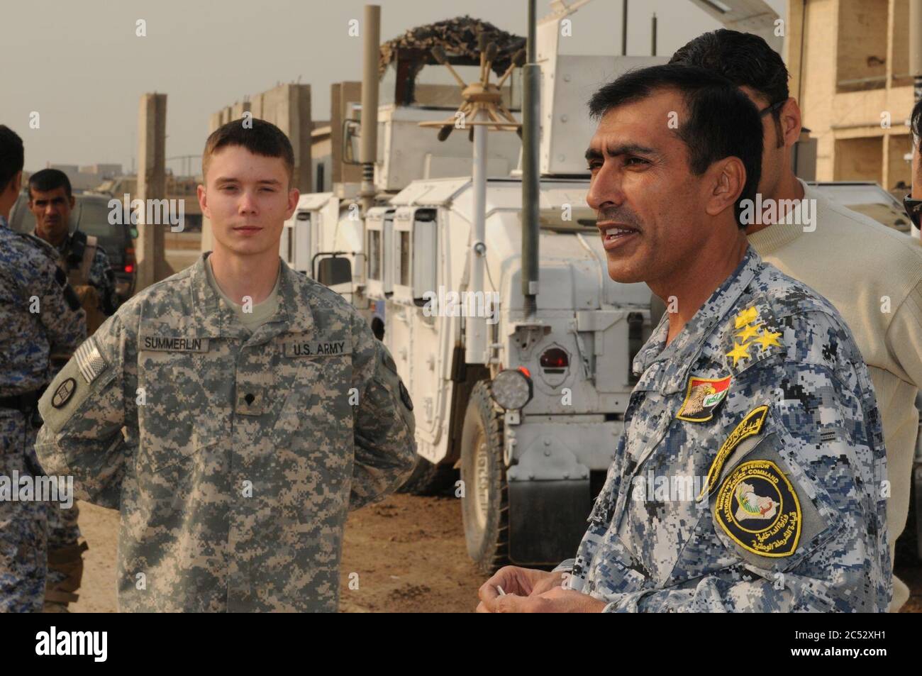 Iraqi Army Brig. Gen. Fiasal Promotes U.S. Soldier Stock Photo - Alamy