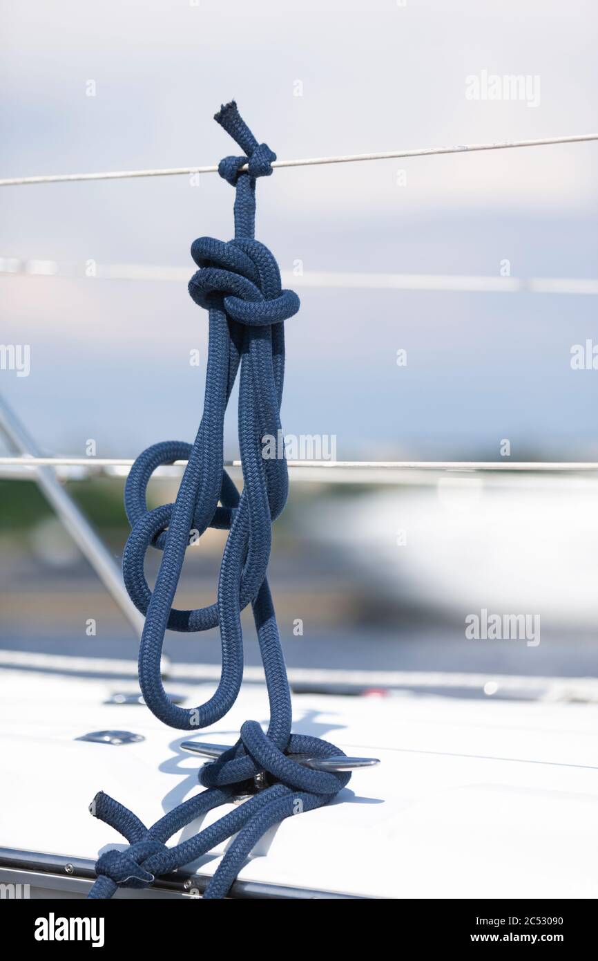 Close up of blue nautical knotted ropes aboard a yacht Stock Photo - Alamy