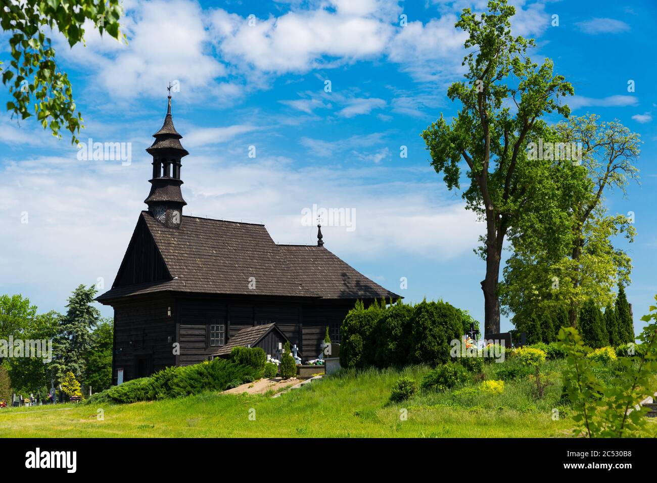 Ancient wooden Roman Catholic St.Isaac church located in cemetery in ...