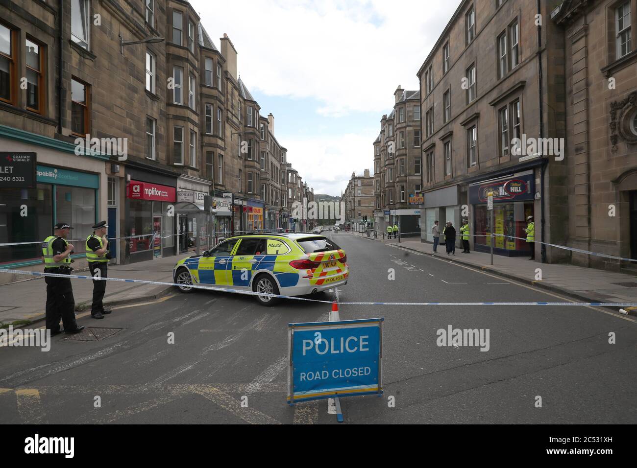 Police road block at the junction of Falcon Road West and Morningside ...
