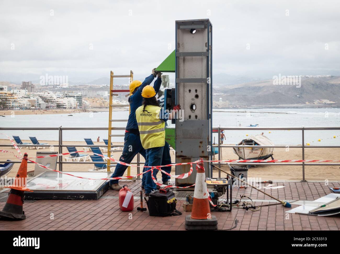 Workmen removing Telefonica telephone booths in Spain Stock Photo - Alamy