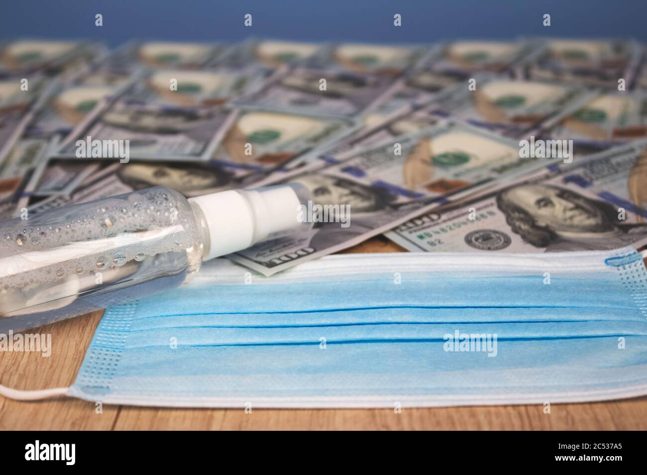 Disposable face mask and antiseptic spray or sanitizer with paper money ...