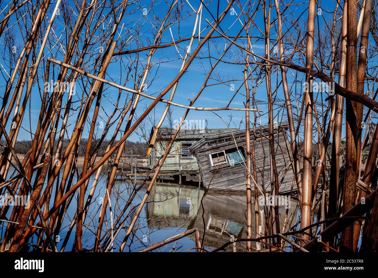 run down small houses at lakeside Stock Photo - Alamy