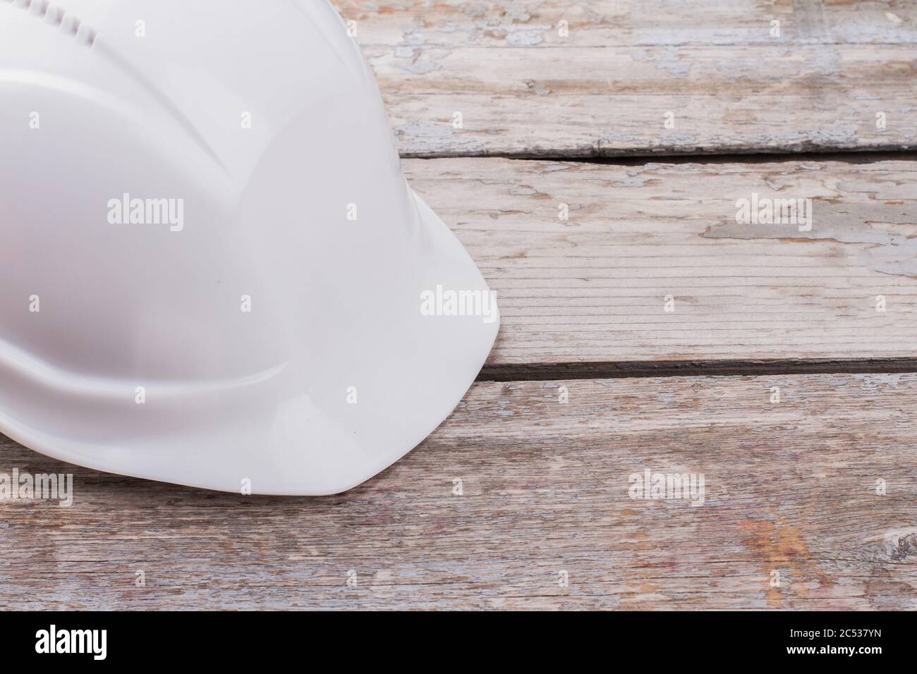 Close up white worker counstructor helmet Stock Photo - Alamy