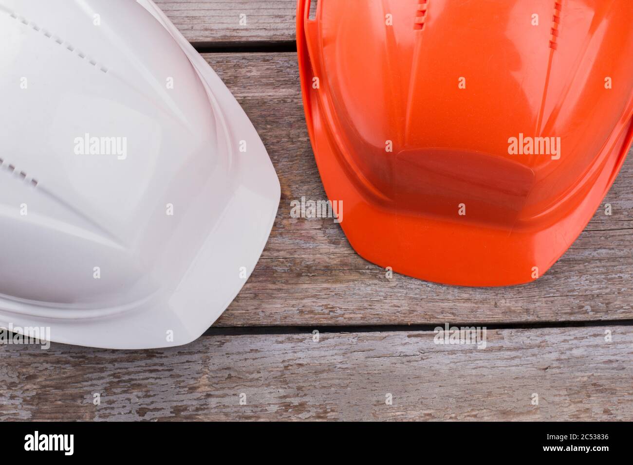 Two plastic builder helmets Stock Photo - Alamy