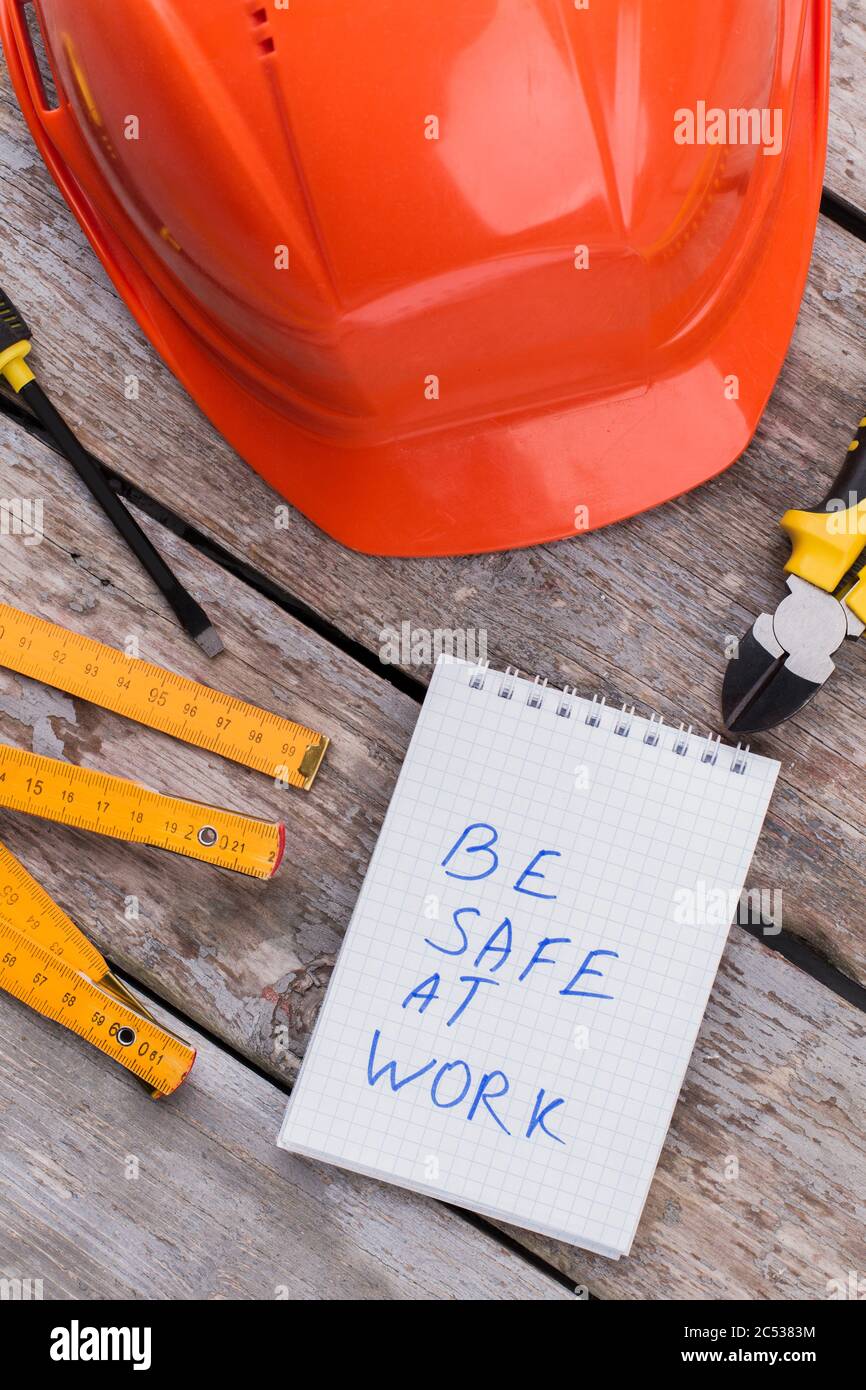 Be safe at work slogan and constructor accessories Stock Photo - Alamy