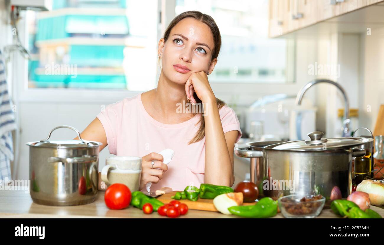 Sad girl portrait kitchen interior hi-res stock photography and images ...
