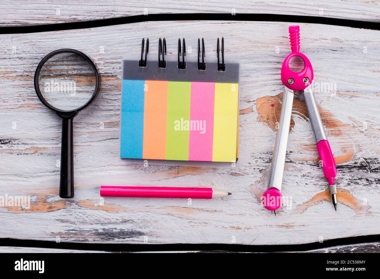 Colored notepad with pink pencil and dividers Stock Photo - Alamy
