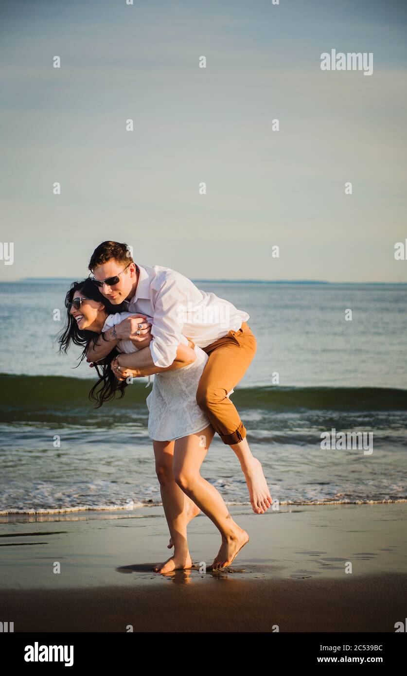 Happy fun young couple playing hi-res stock photography and images - Alamy