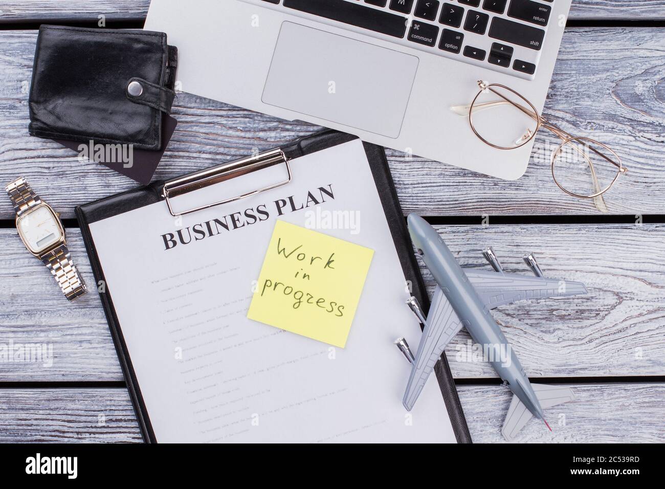 Business items and work in progress note Stock Photo - Alamy