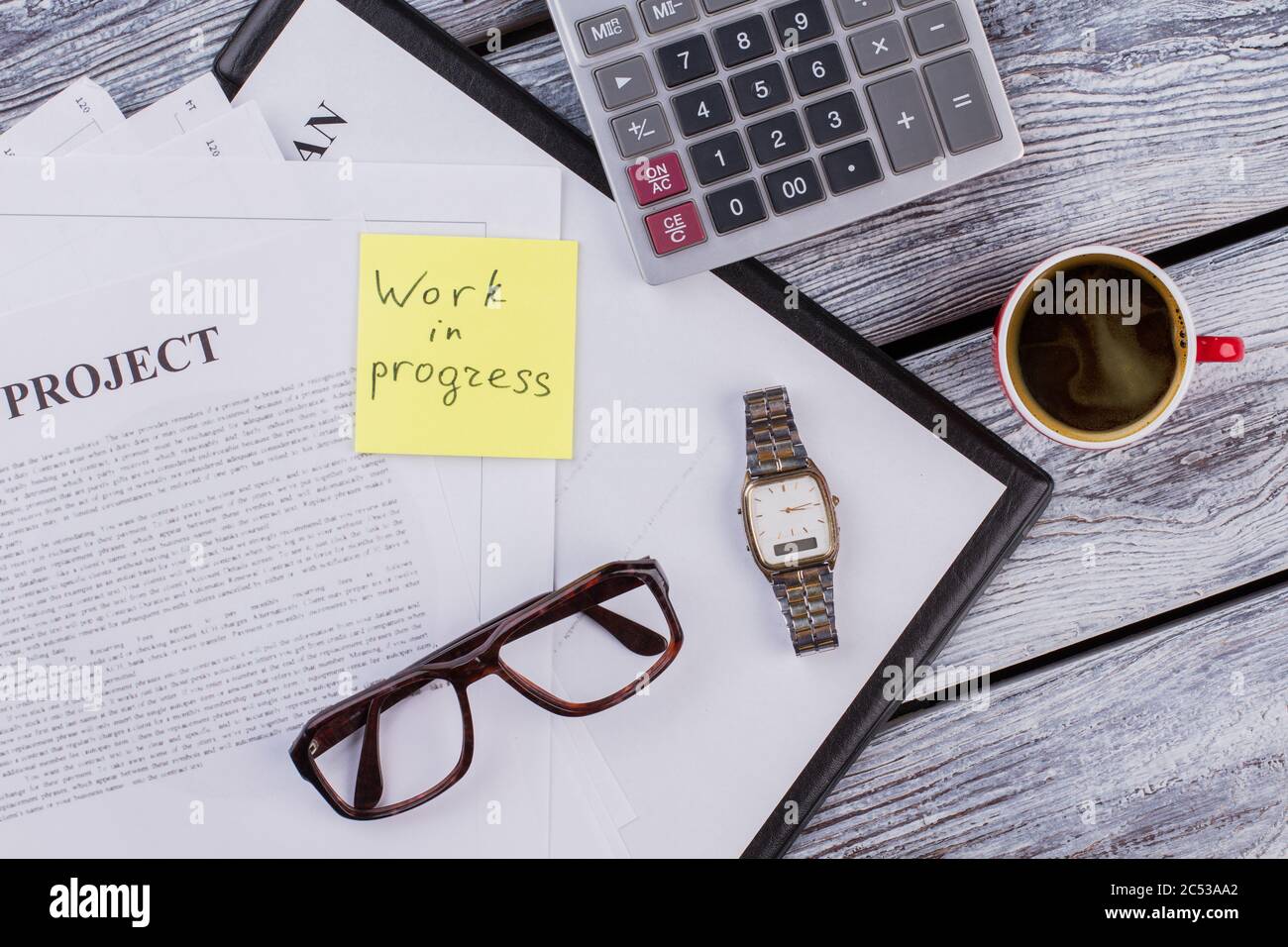 Flat lay work in progress concept Stock Photo - Alamy