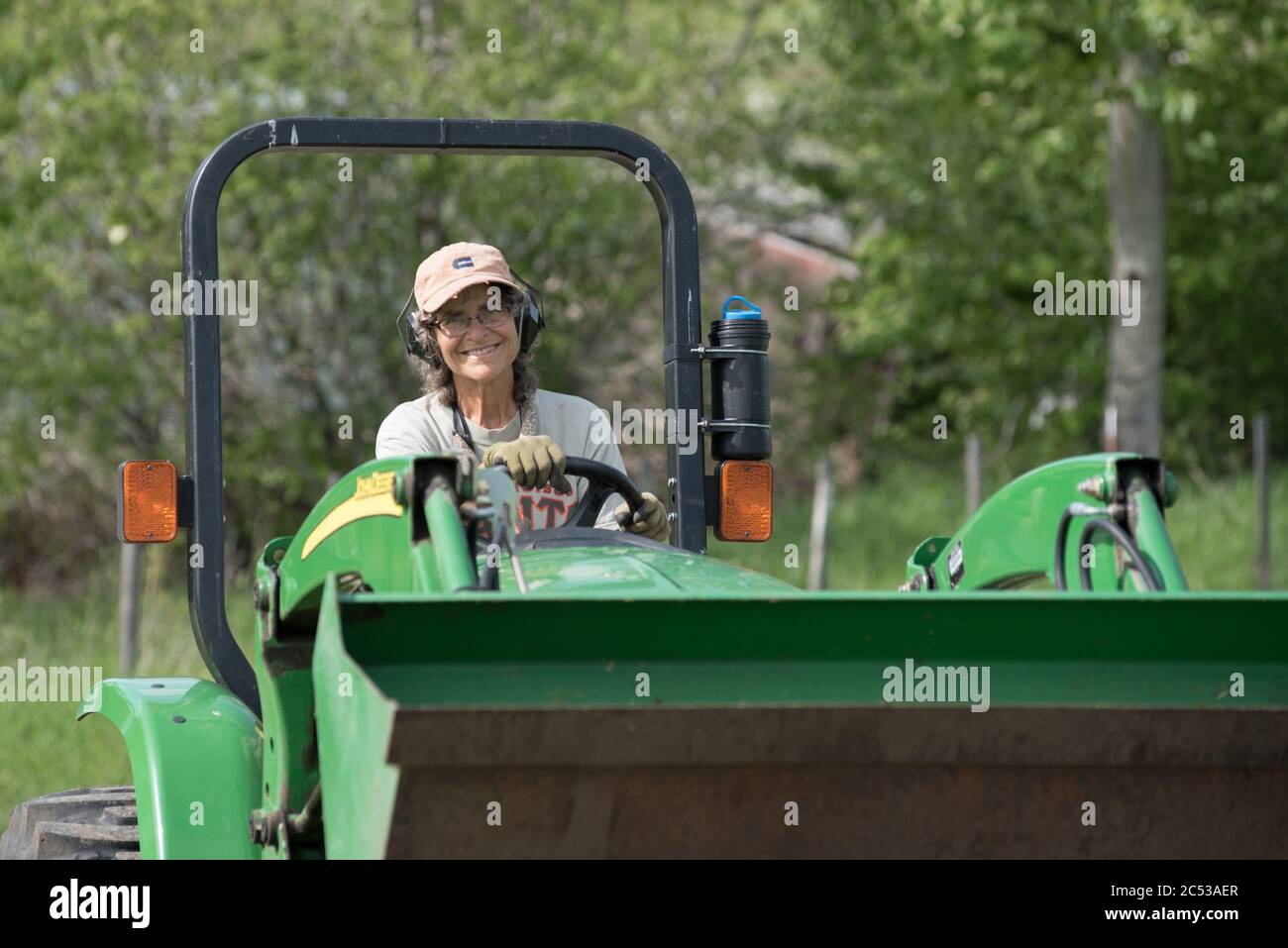 Woman driving tractor hi-res stock photography and images - Alamy