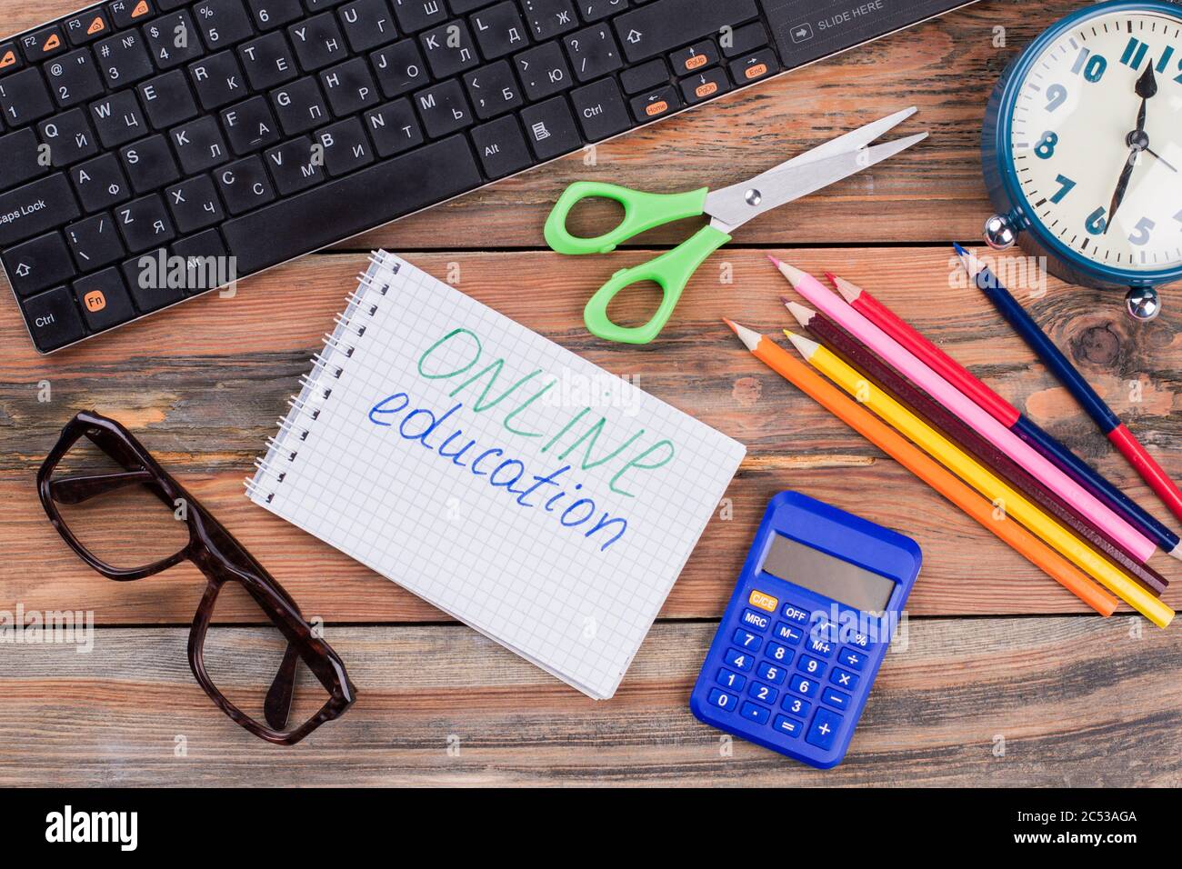 Accessories for studying on a wooden desk Stock Photo - Alamy
