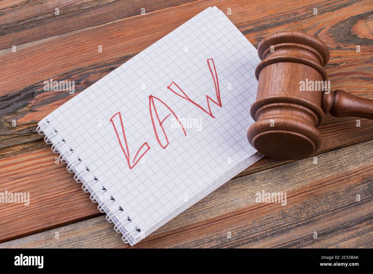 Close-up laws words written on spiral notepad and gavel Stock Photo - Alamy
