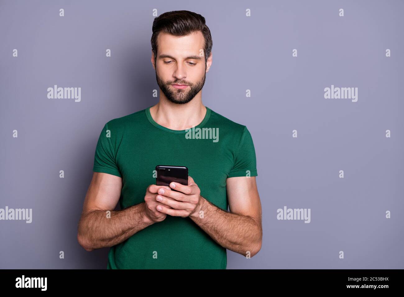 Portrait of minded focused guy use smartphone repost share social ...