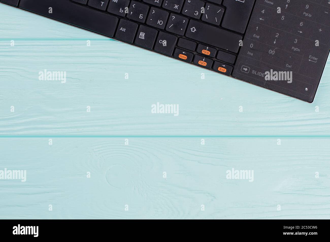 Modern computer keyboard on light blue background Stock Photo - Alamy