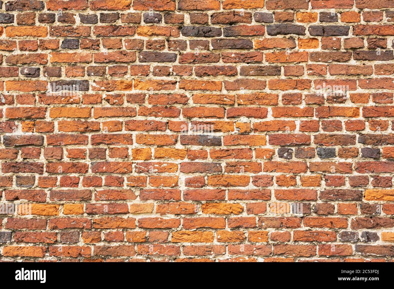 Wall with old worn vintage bricks Stock Photo - Alamy