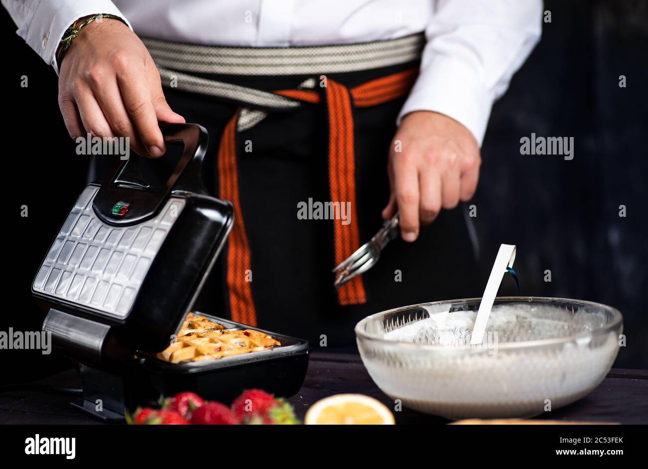 Man making waffles in hi-res stock photography and images - Alamy