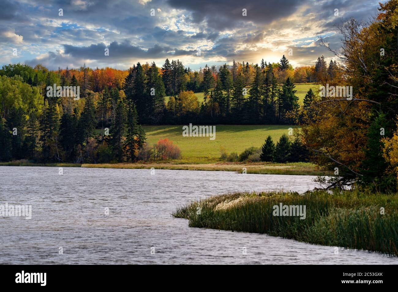 A river running through a fall landscape in rural Prince Edward Island ...