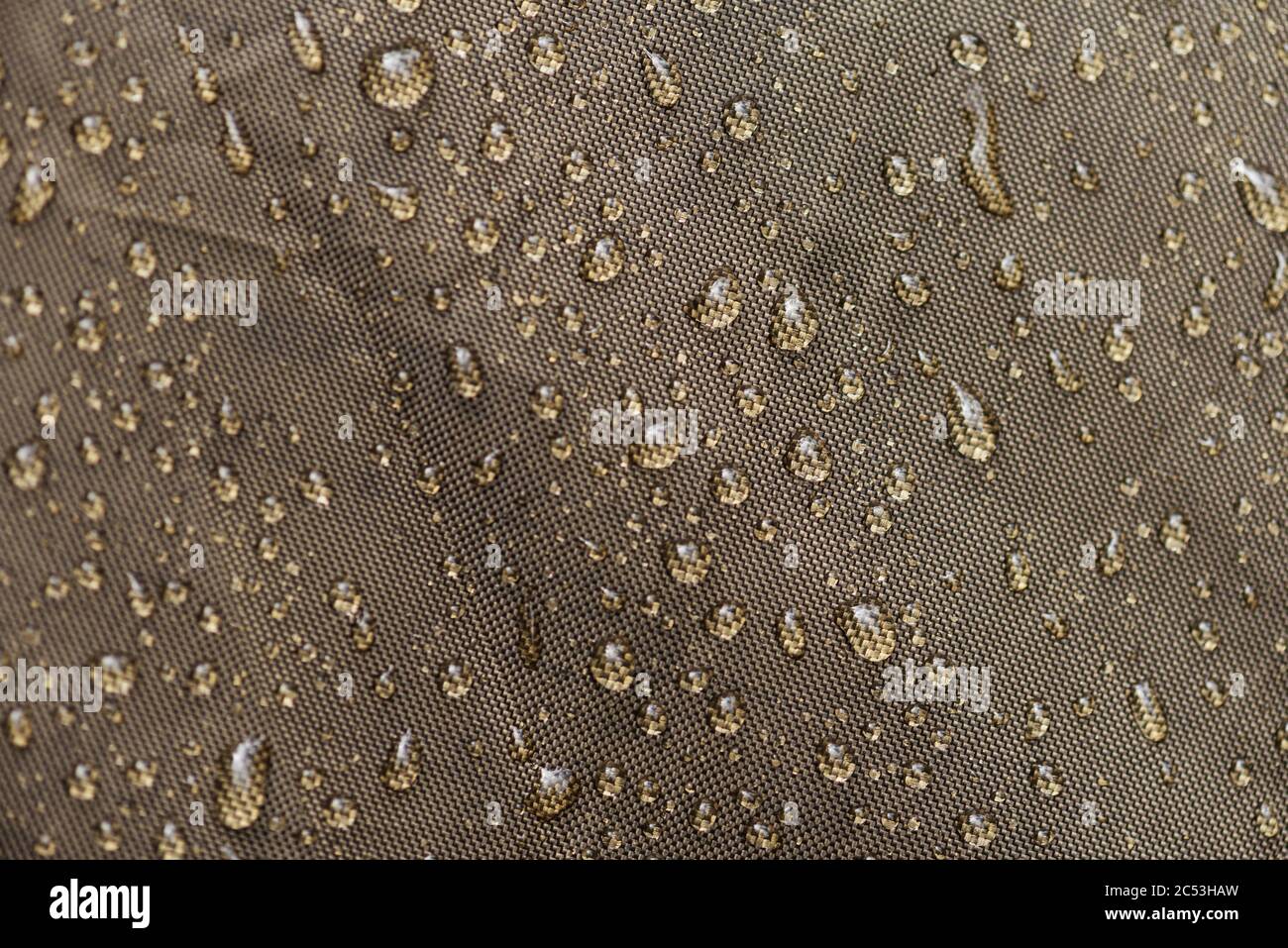 Drops of rain, water on a waterproof fabric close-up. Tent with ...