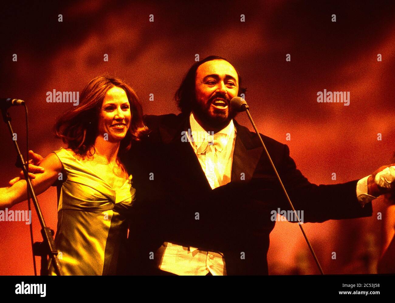Luciano Pavarotti with Cheryl Crow at Pavarotti & Friends concert in ...