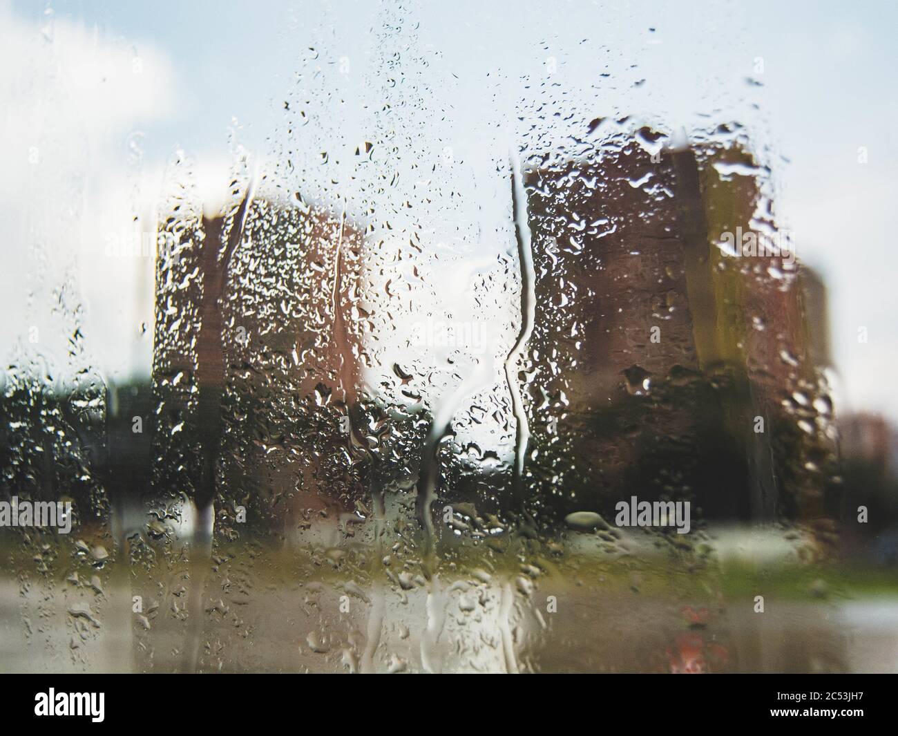 Raindrops falling down the window Stock Photo - Alamy