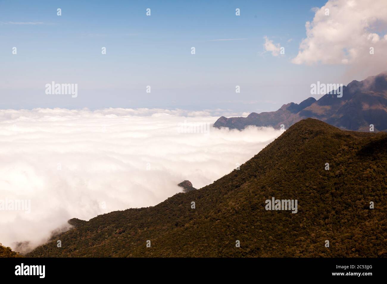 Mountain landscape with clouds below Stock Photo - Alamy