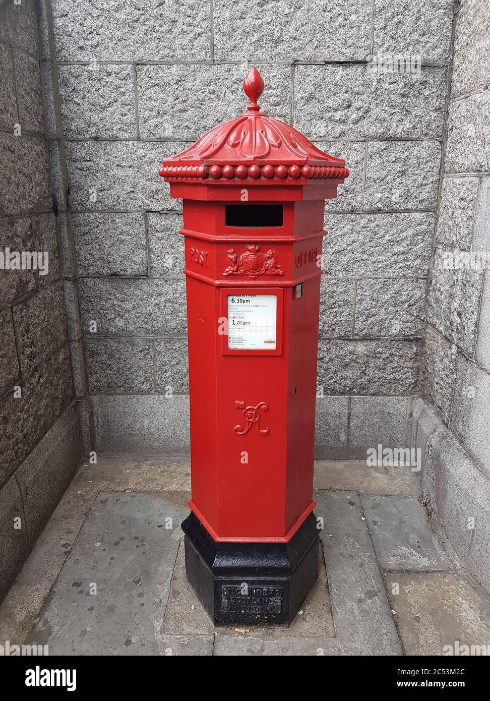 Red british post box in a city street High Resolution Stock Photography ...