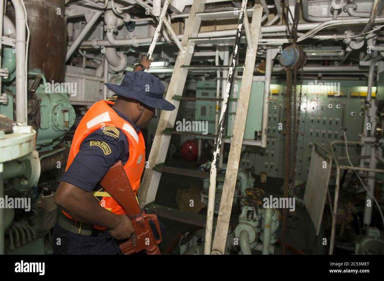 In a training exercise a Mozambique Marine boards a tugboat ...