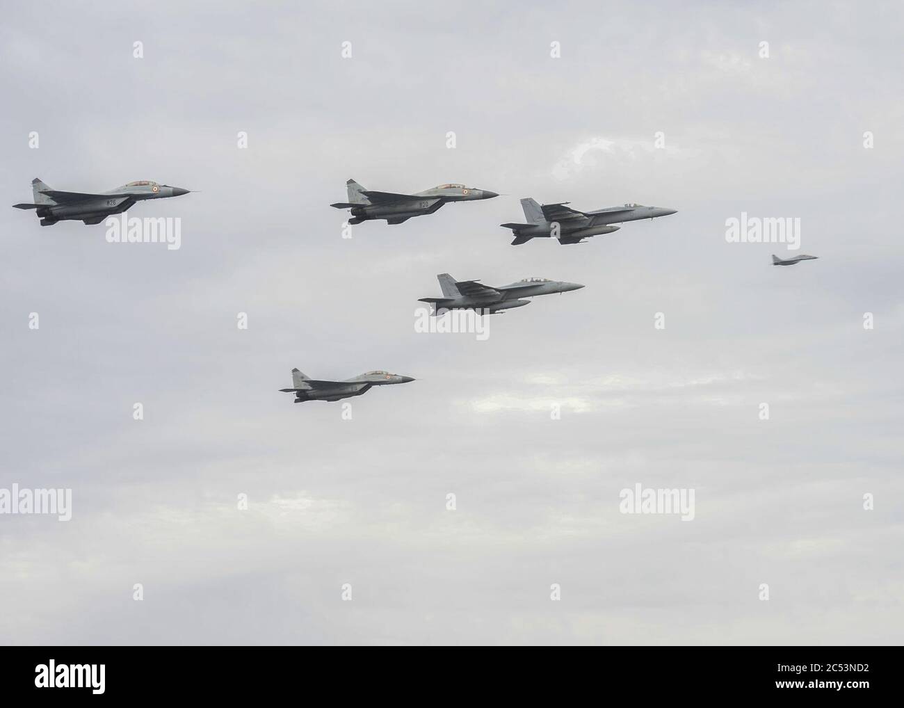 Indian Navy MIG-29K Fulcrums fly over the aircraft carrier USS Nimitz ...
