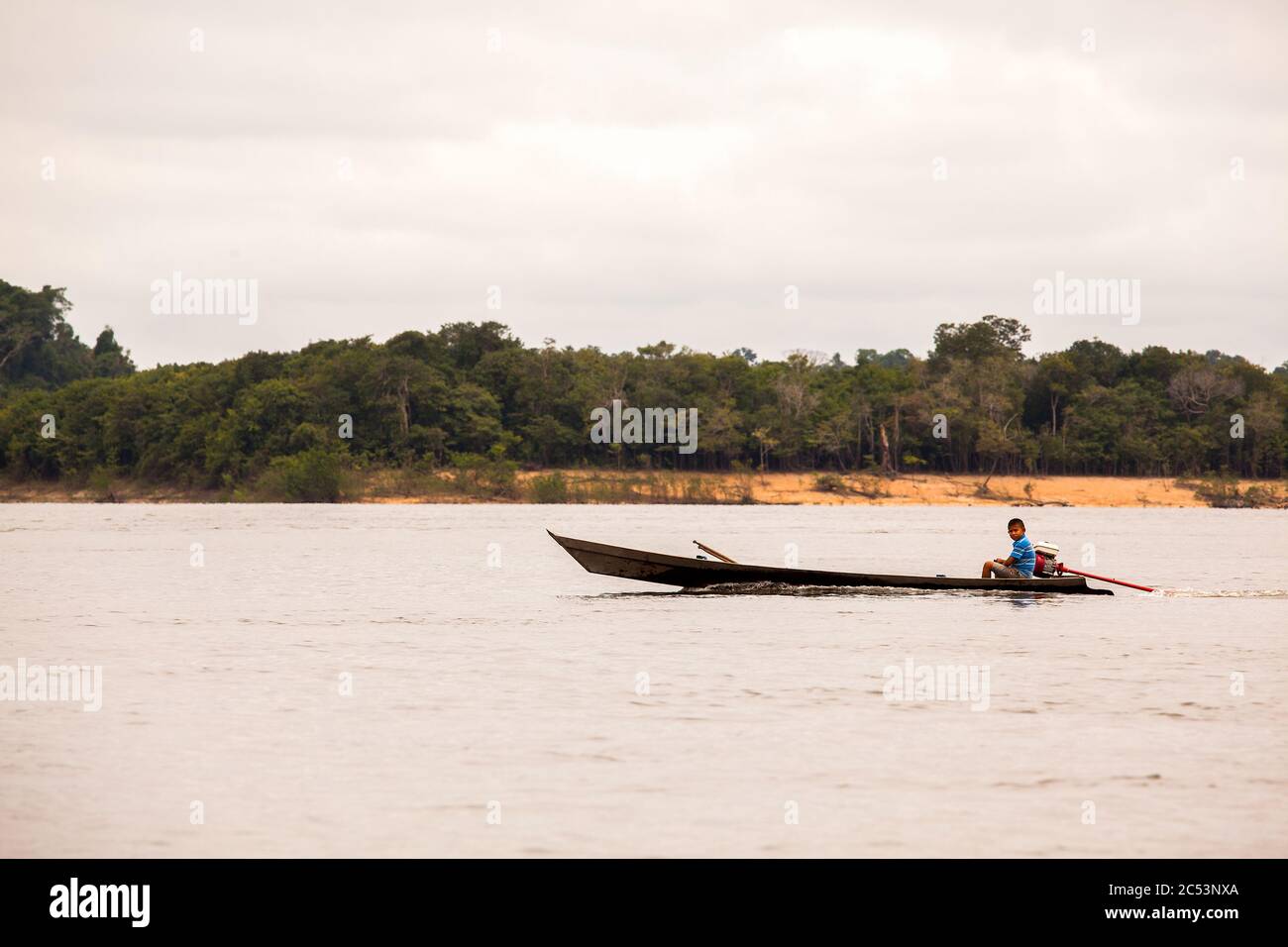 Boy driving boat hi-res stock photography and images - Alamy