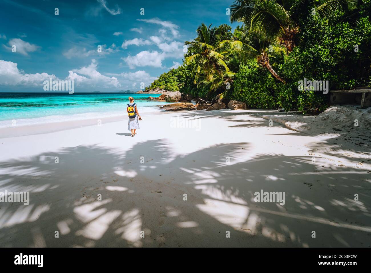 Travel tourist female enjoy tropical epic beach with palm trees and ...