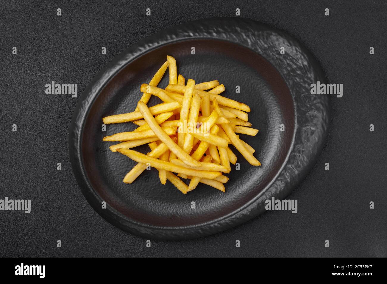Portion of side dish in gray plate - crispy fat french fries Stock ...
