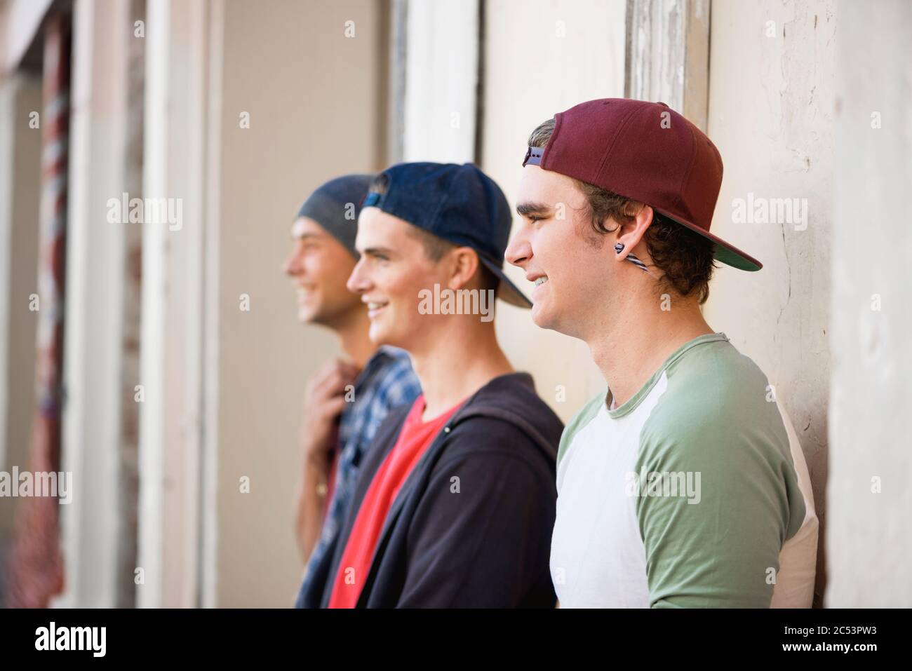 Three guys walking together in hi-res stock photography and images - Alamy