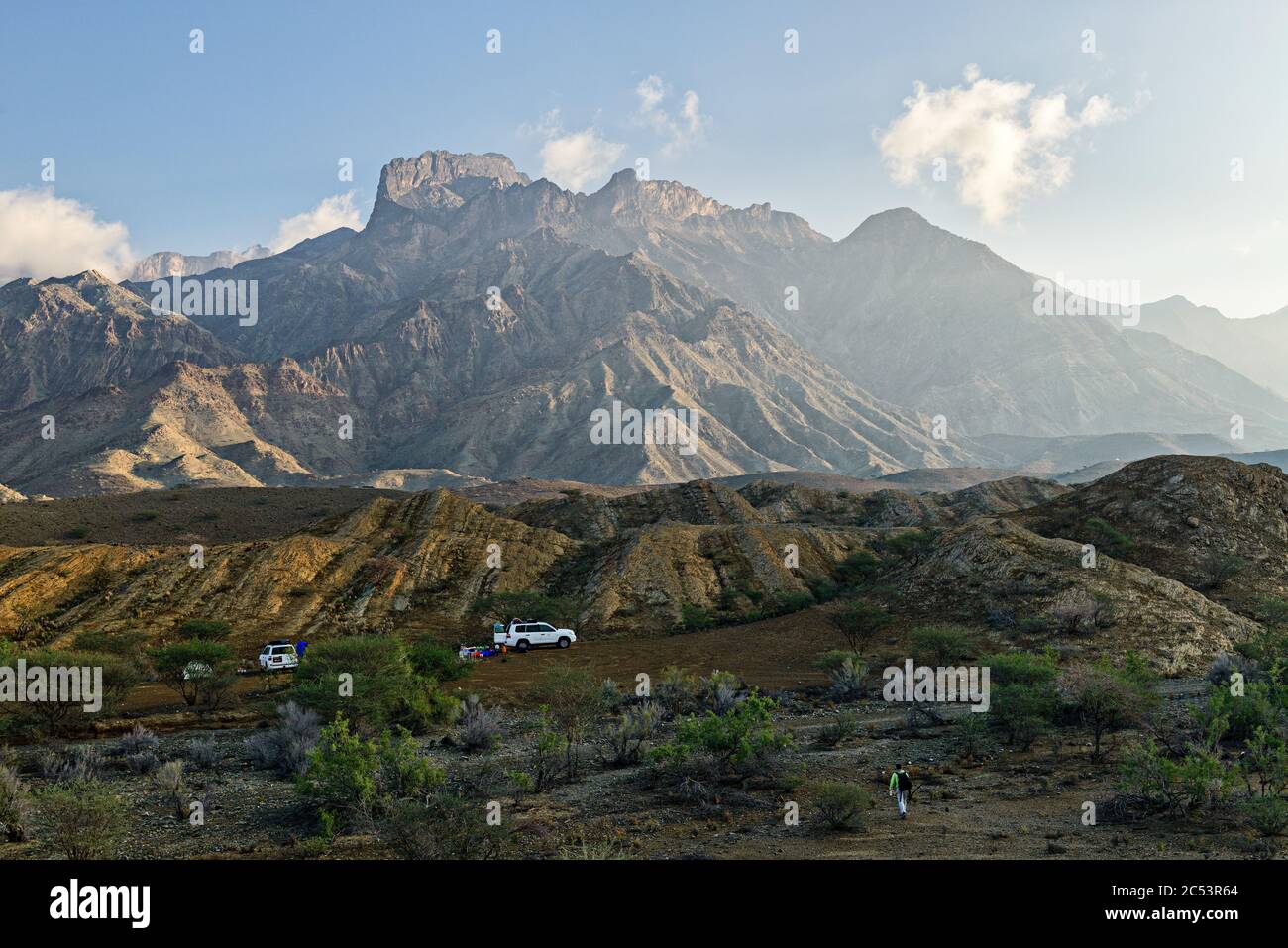 Dawn, morning sun, rocks, mountainside, clouds, cars Stock Photo - Alamy