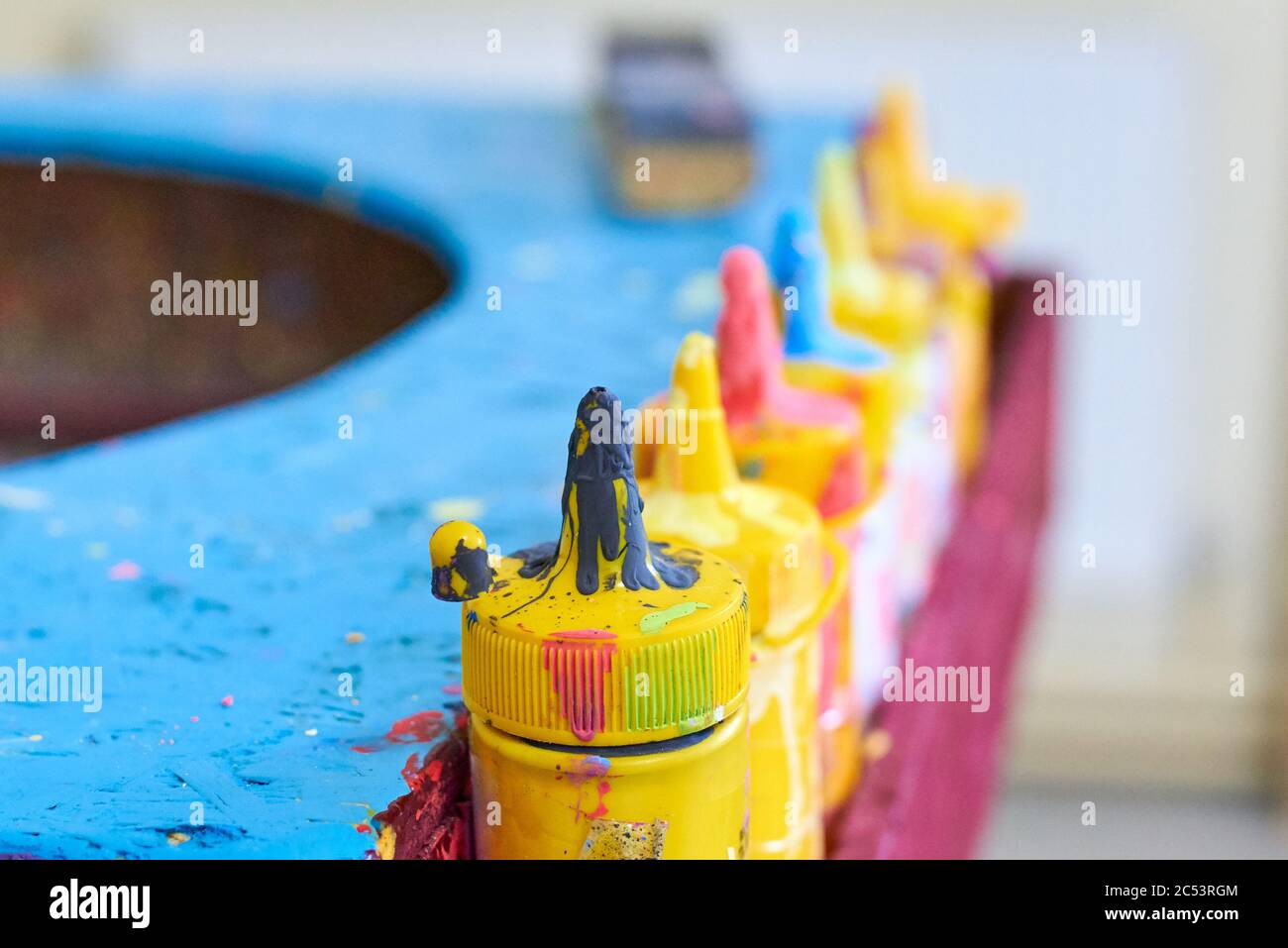 Photo of open multi-colored big jars with paint Stock Photo - Alamy