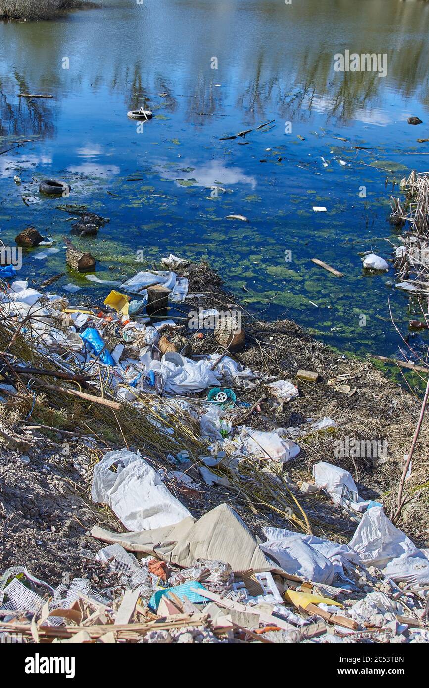 Garbage thrown to the bank of a drying out river, the topic of ...