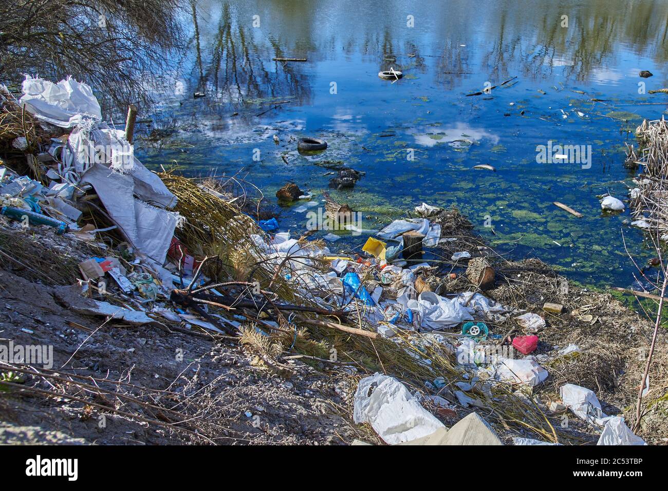 Garbage thrown to the bank of a drying out river, the topic of ...
