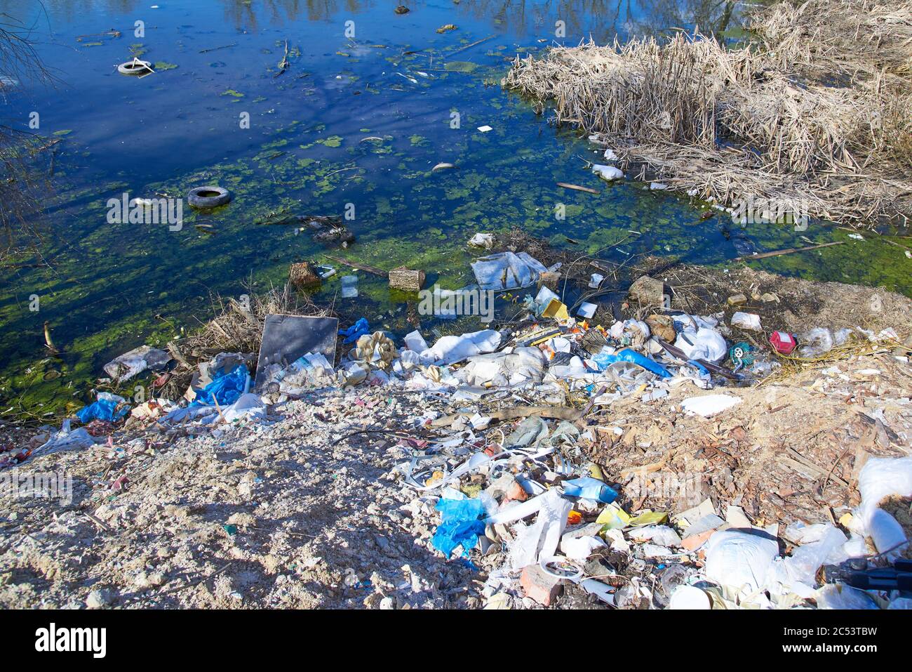 Garbage thrown to the bank of a drying out river, the topic of ...