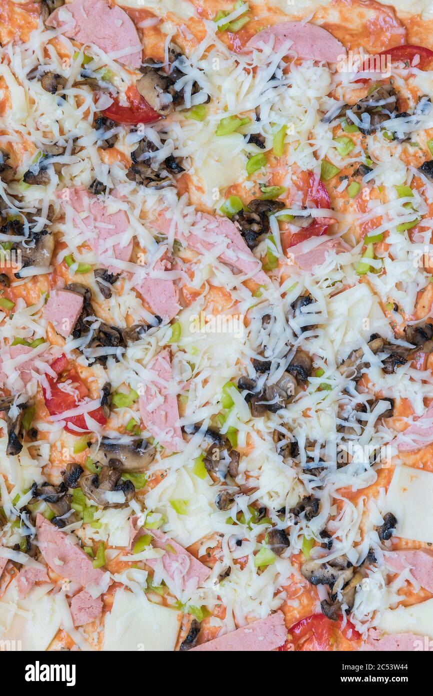 Pizza stuffed with the right ingredients and awaiting preparation Stock ...