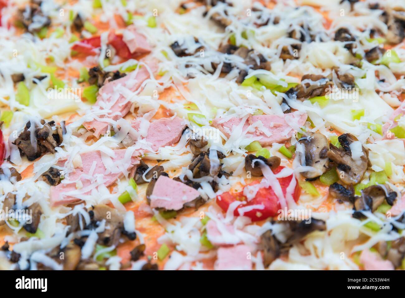 Pizza stuffed with the right ingredients and awaiting preparation Stock ...