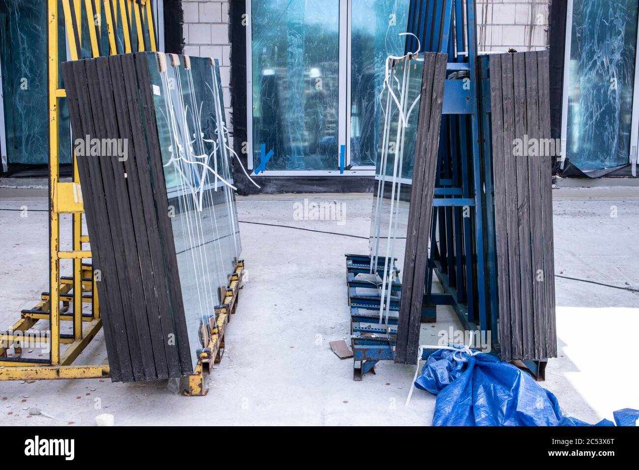 Stand with large glass panes on the construction site Stock Photo - Alamy