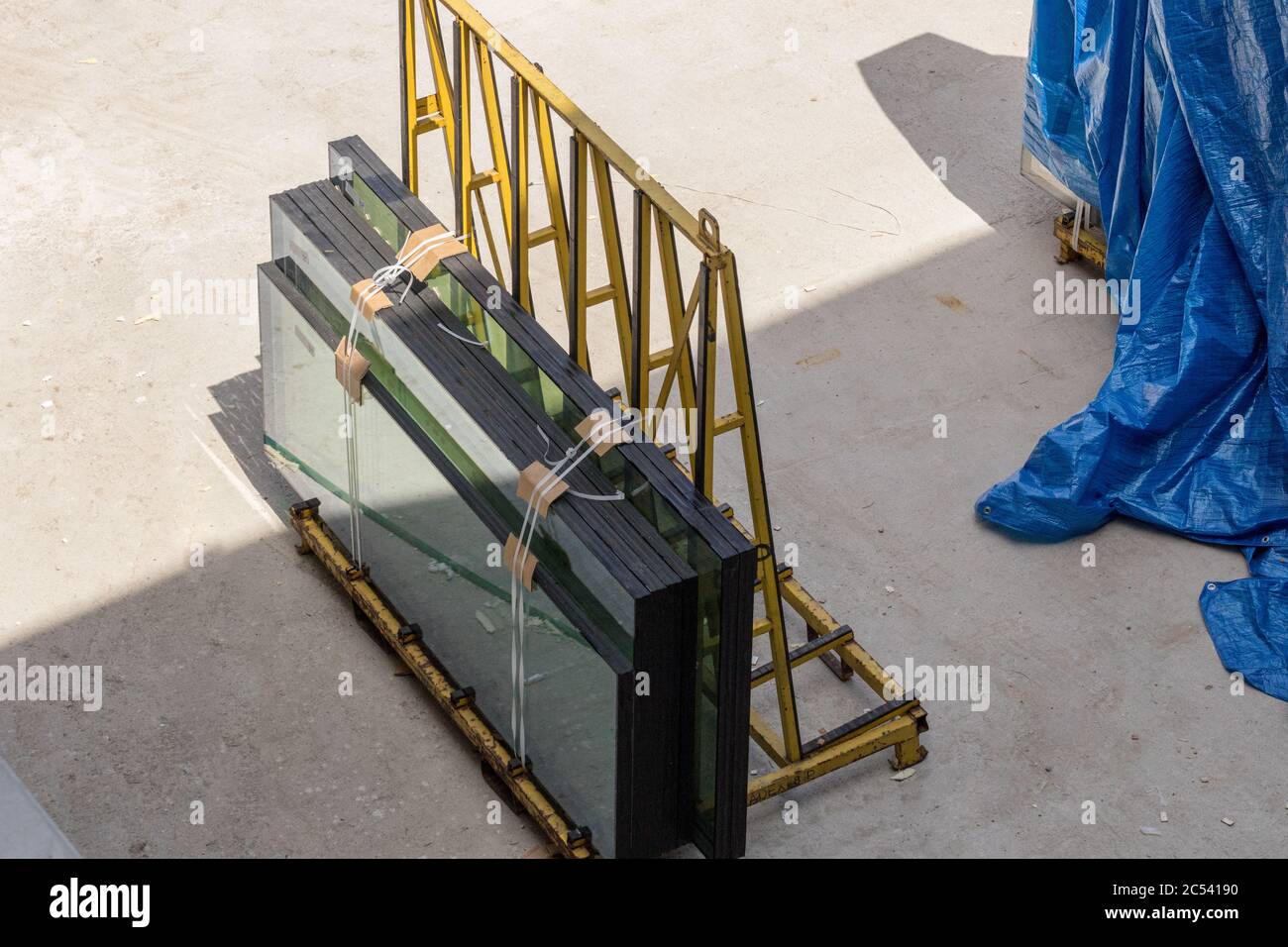 Stand with large glass panes on the construction site Stock Photo - Alamy