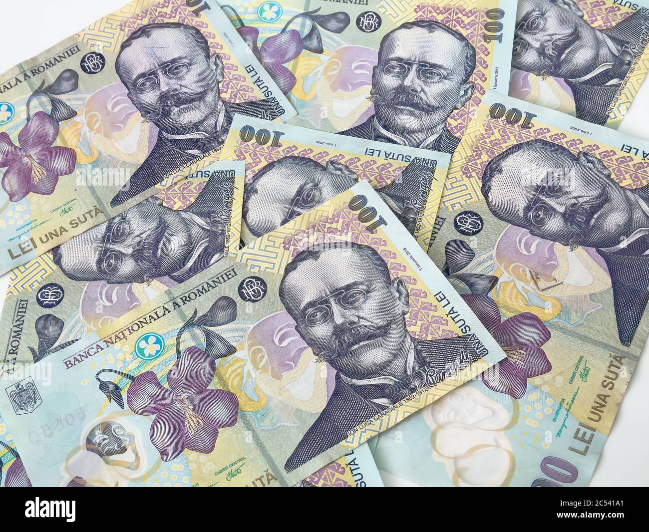 Many 100 RON or lei romanian banknotes on white background. Romanian ...